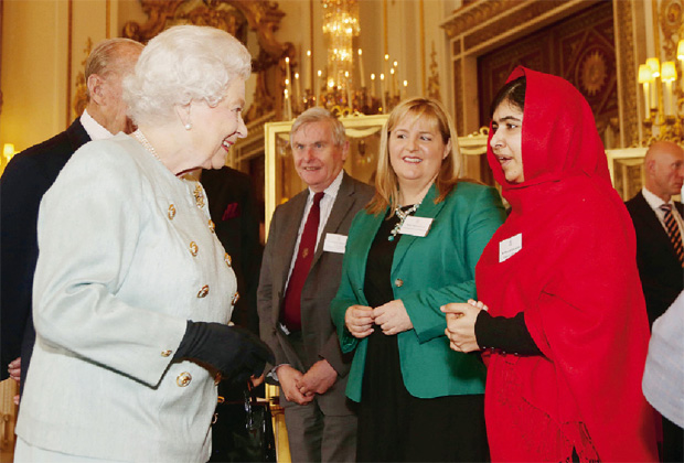 Malala all smiles as she meets Queen Elizabeth